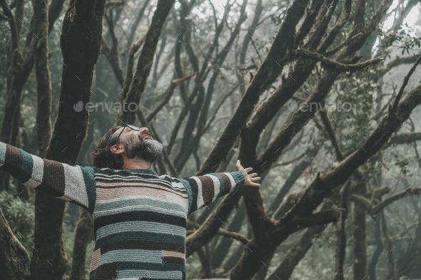 Nature lover concept lifestyle. Happy tourist opening arms and enjoying ...