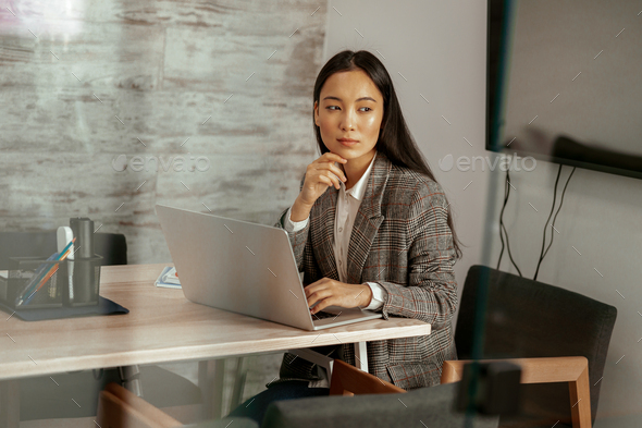 Pretty asian business woman working laptop sitting in modern office and ...