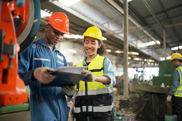 Three Diverse Multicultural Heavy Industry Engineers and Workers in ...