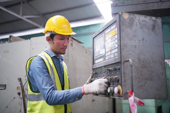 mechanics engineer operating lathe machine for metalwork in metal work ...