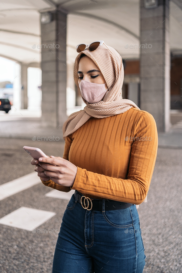 Pretty Muslim Woman with Face Mask Stock Photo by nunezimage | PhotoDune