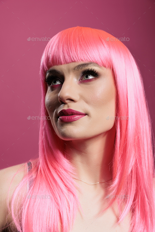 Portrait of female model with pink hair wig and trendy makeup Stock ...