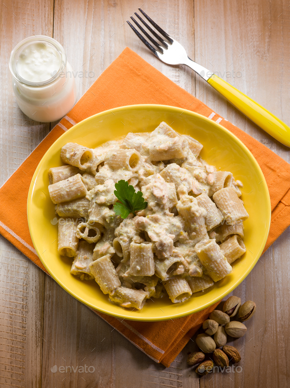 pasta with fish ragout pistachio and cream sauce Stock Photo by MarcoMayer
