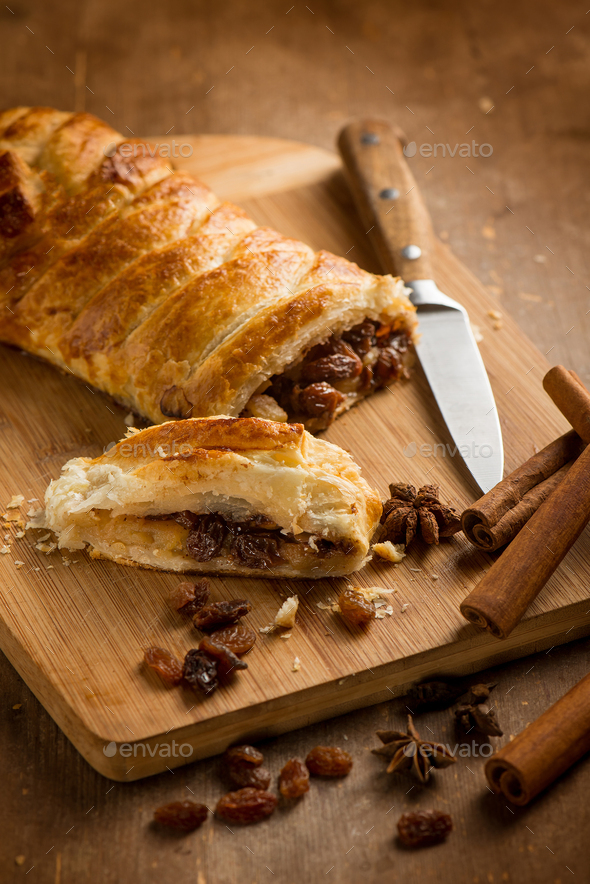 apple strudel with cinnamon stick and dried grape Stock Photo by MarcoMayer
