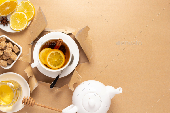 Cup of tea with lemon and honey on torn paper. Mug full of tea Stock ...
