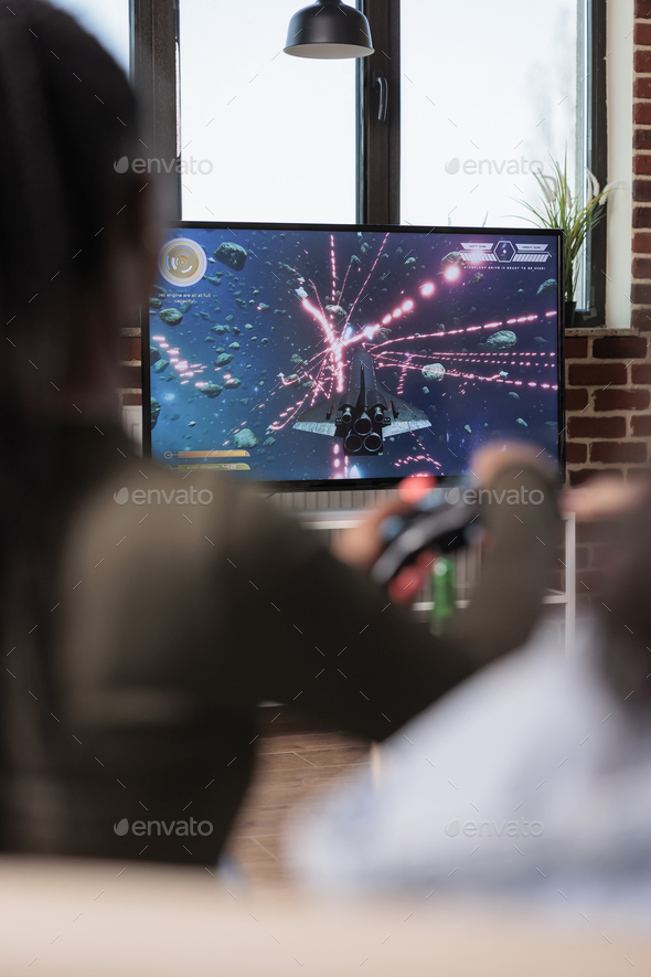 African american adult playing video games with tv console Stock Photo ...