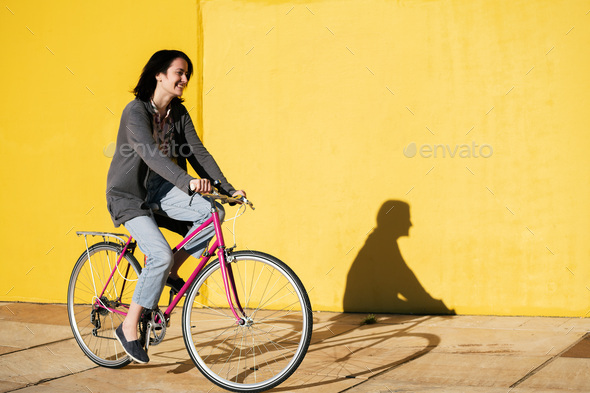teenage girl smiles as she rides on her retro bike Stock Photo by Raul ...