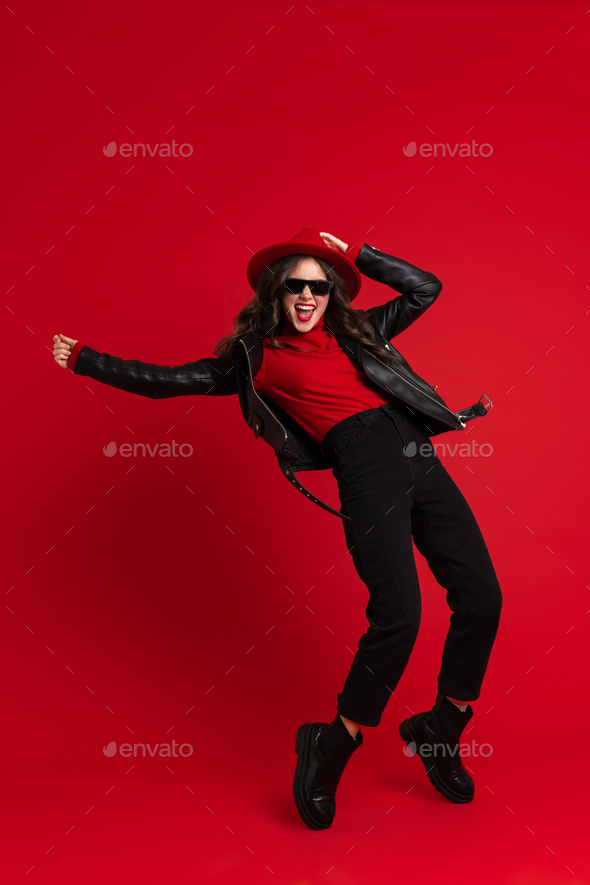 White woman in leather jacket laughing while dancing on camera Stock ...