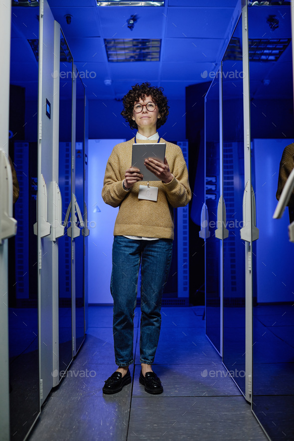 Engineer using tablet for setting up system at data center Stock Photo ...