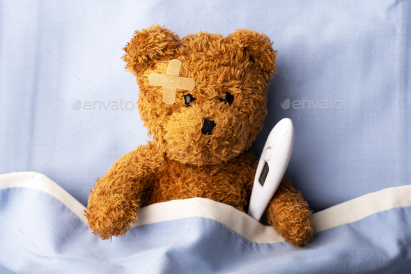 Sick teddy bear on hospital bed Stock Photo by ivankmit | PhotoDune