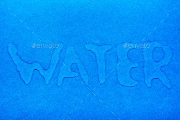 The word "water" is written with water droplets on a blue smooth ...