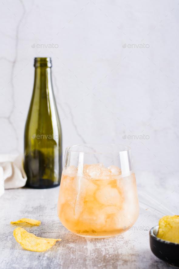 Beer slush in a glass on the table. Frozen summer drink. Vertical view ...