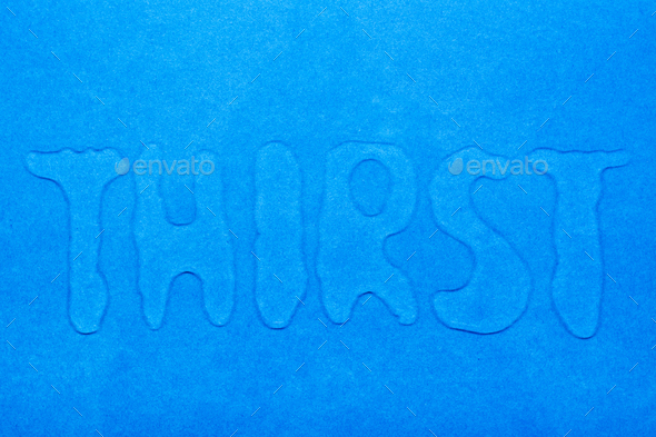 The word "thirst" is written with water droplets on a blue smooth ...