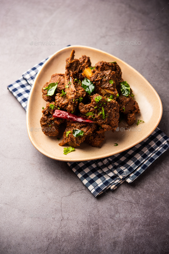 Sukha mutton or chicken, dry spicy Murgh or goat meat served in a plate ...