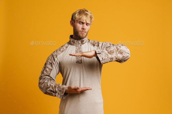 White military man wearing uniform frowning and holding copyspace Stock ...