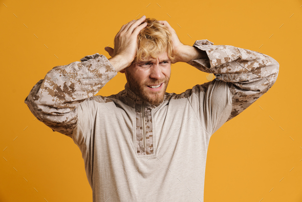 White military man with headache frowning and holding his head Stock ...