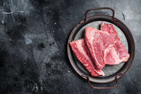 Raw Silverside sirloin beef steak cut on butcher tray. Black background ...