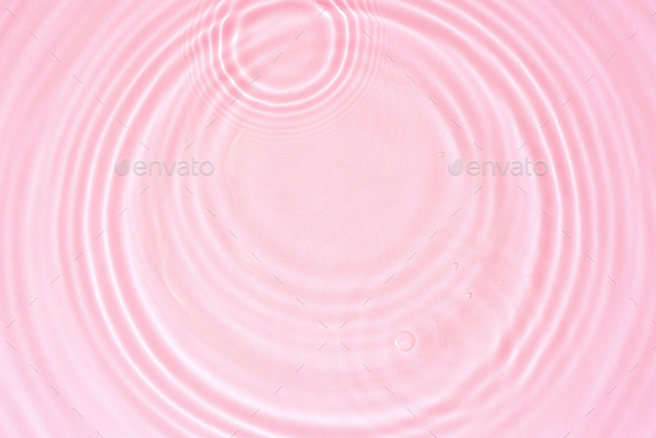 Cosmetic pink water texture, pink water surface with rings and ripples ...
