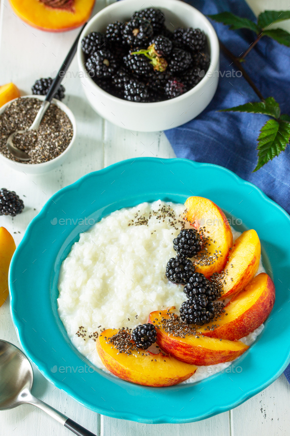Rice porridge with chia, peach and blackberry in a bowl Stock Photo by ...