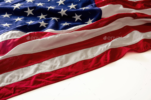 USA flag ripple on white color, copy space. National American holiday ...
