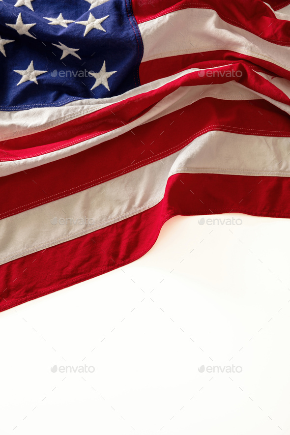 USA flag ripple on white color, copy space. National American holiday ...