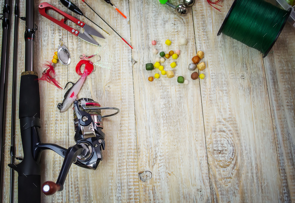 fishing tackles for anglers - swimmers, plummets and tools on wooden ...