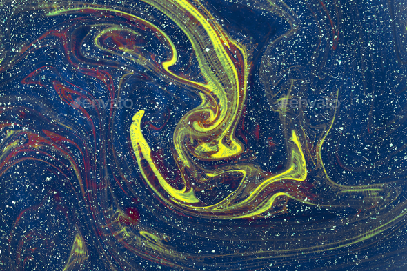 Abstract blue and yellow drawing with paints on the water. Ebru ...