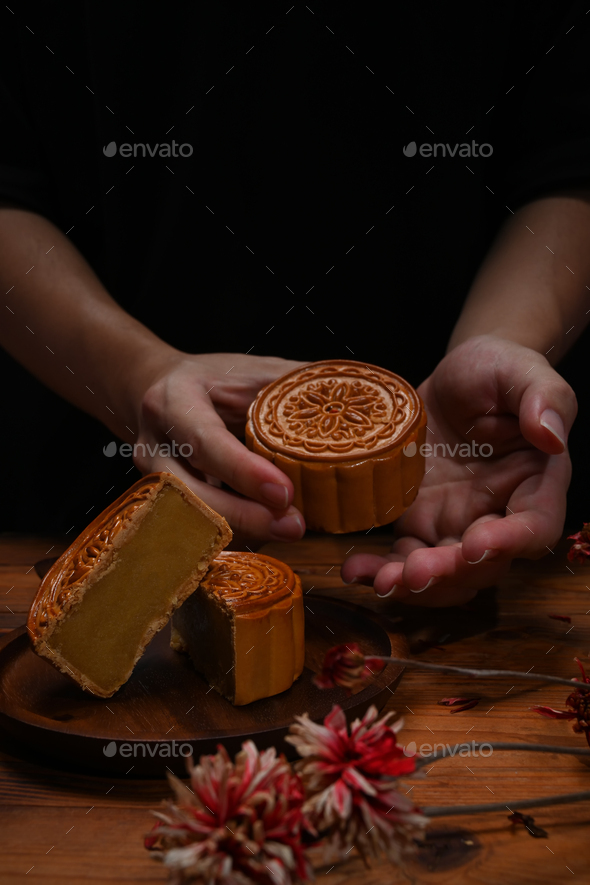 Close up view hands holding Chinese traditional mooncake. Stock Photo ...
