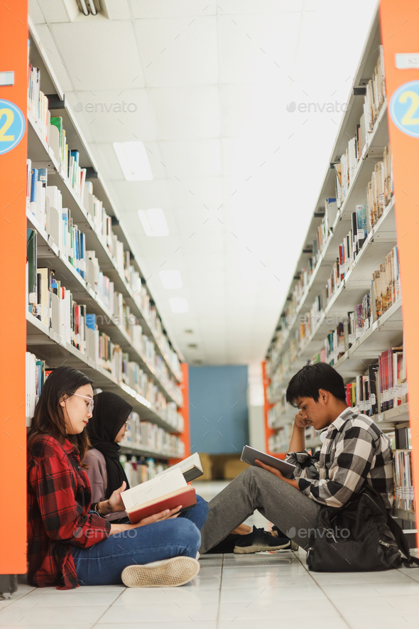 College students are reading book at the hallway of library Stock Photo ...