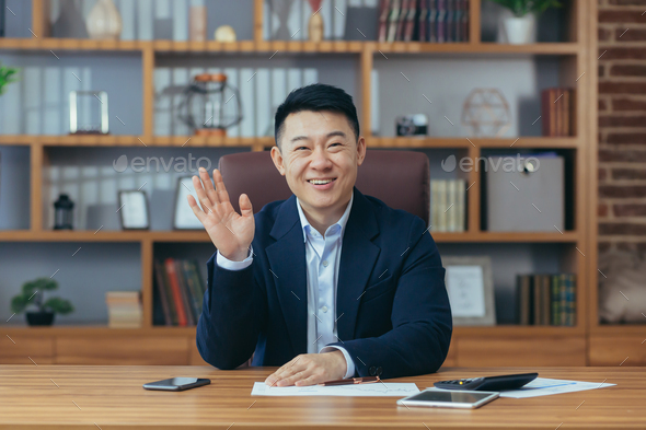 Portrait of a young handsome Asian man diplomat, director, businessman ...
