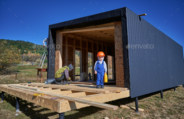 Boy toddler playing as builder on construction site Stock Photo by ...