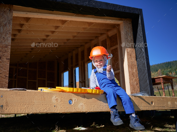 Boy toddler playing as builder on construction site Stock Photo by ...