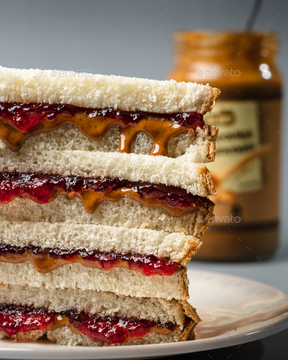 stack of peanut butter and strawberry jelly sandwich Stock Photo by pblskll