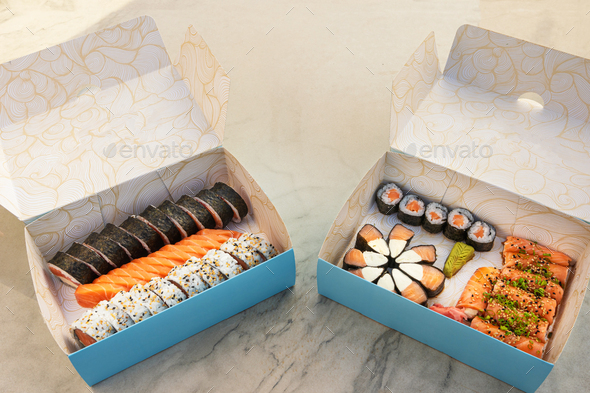 box with variety of sushi Maki, Inari, Sashimi, Nigiri, Uramaki, Gohan ...