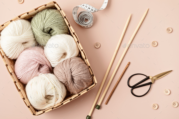 Craft hobby background with yarn in natural colors Stock Photo by OksaLy