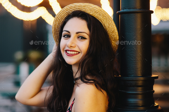 Close up portrait of beautiful female with dark appealing eyes, smiling ...
