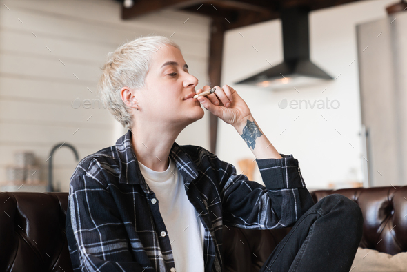 Hipster woman girl smoking cigarette joint with marijuana cannabis ...