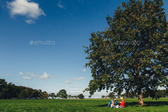 Portrait of beautiful nature and family who has picnic in background ...