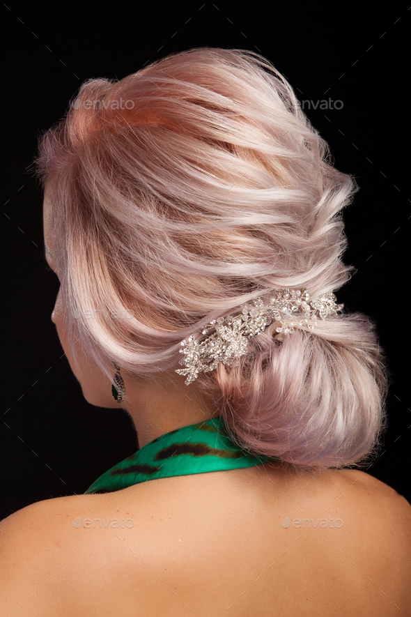 Back view of beautiful young bride with modern coiffure nd hair ...