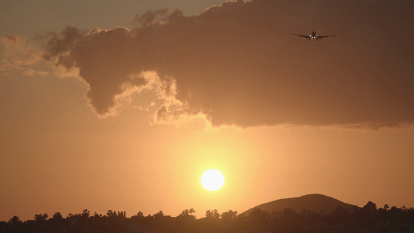 Evening Sky with Golden Sun and Flying Airplane, Stock Footage | VideoHive