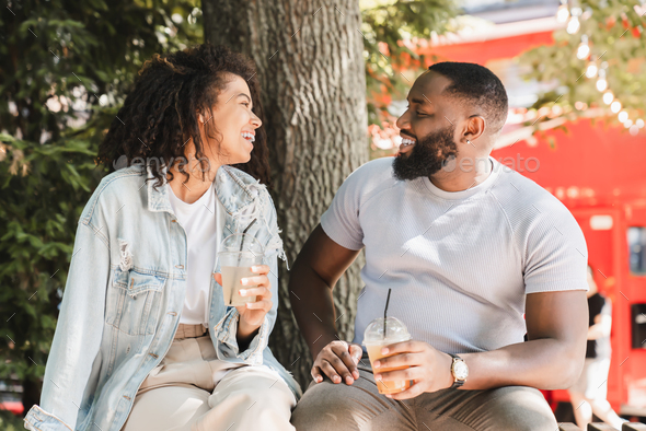 African-american romantic couple having romantic date, drinking ...