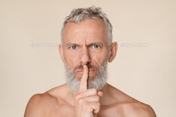 Silent gesture. Caucasian mature middle-aged man showing hush, finger ...