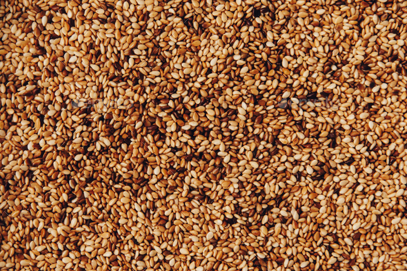 Lots of white roasted sesame macro photography. Stock Photo by JuliaMois