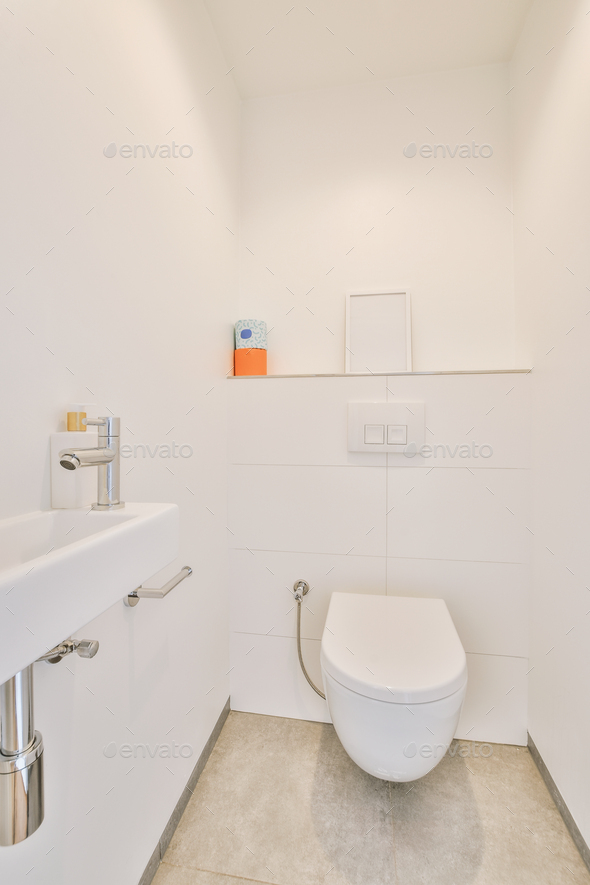Lavatory with toilet and sink Stock Photo by pro_creator | PhotoDune