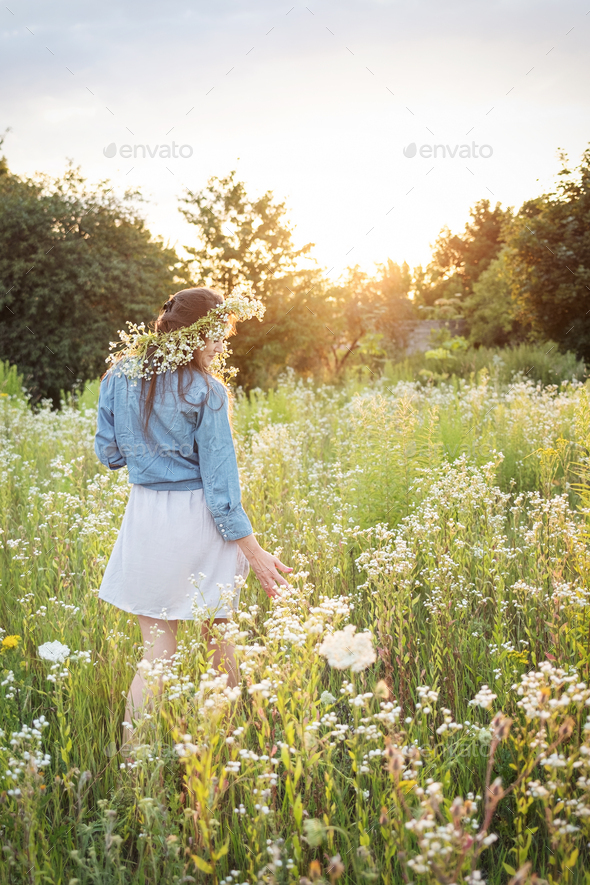 Beautiful Woman Walking In Flower Field Stock Photo by Olena_Rudo ...