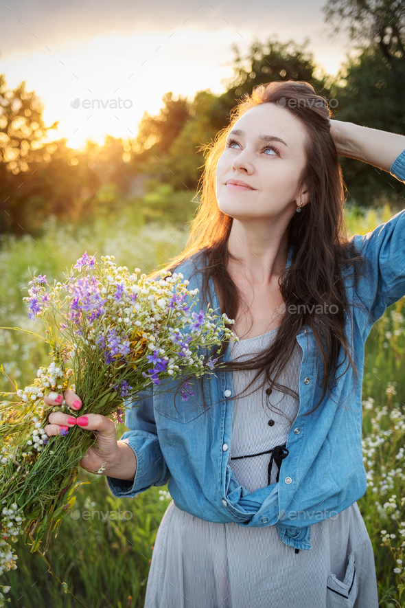 Beautiful Woman Walking In Flower Field Stock Photo by Olena_Rudo ...