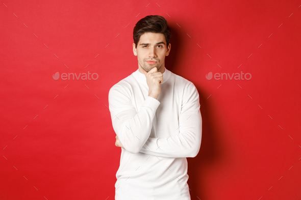 Image of thoughtful handsome man making assumption, thinking and ...