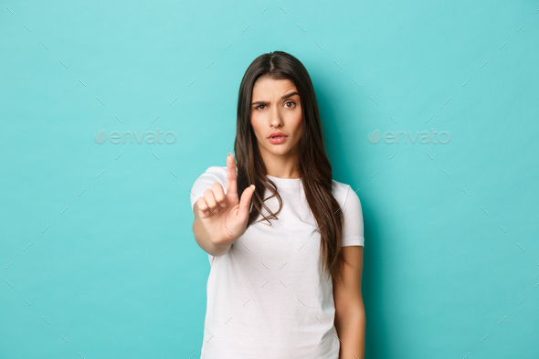 Serious and confident brunette woman disagree, shaking finger in ...