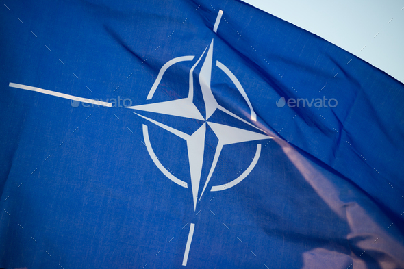 NATO flag.North Atlantic Treaty Organization flag waving. Stock Photo ...