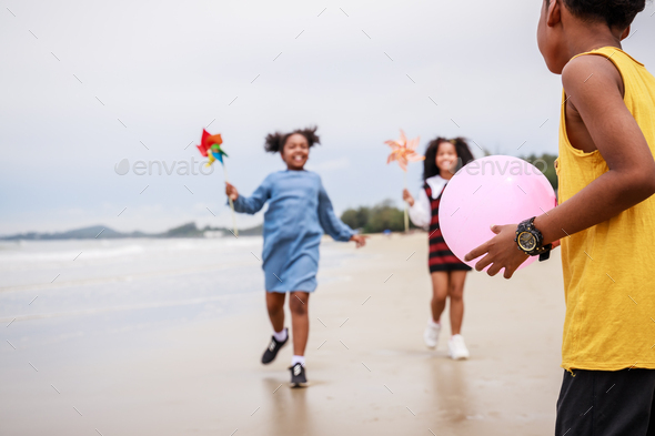 Happy vacation. Children or kids playing and standing together at the ...